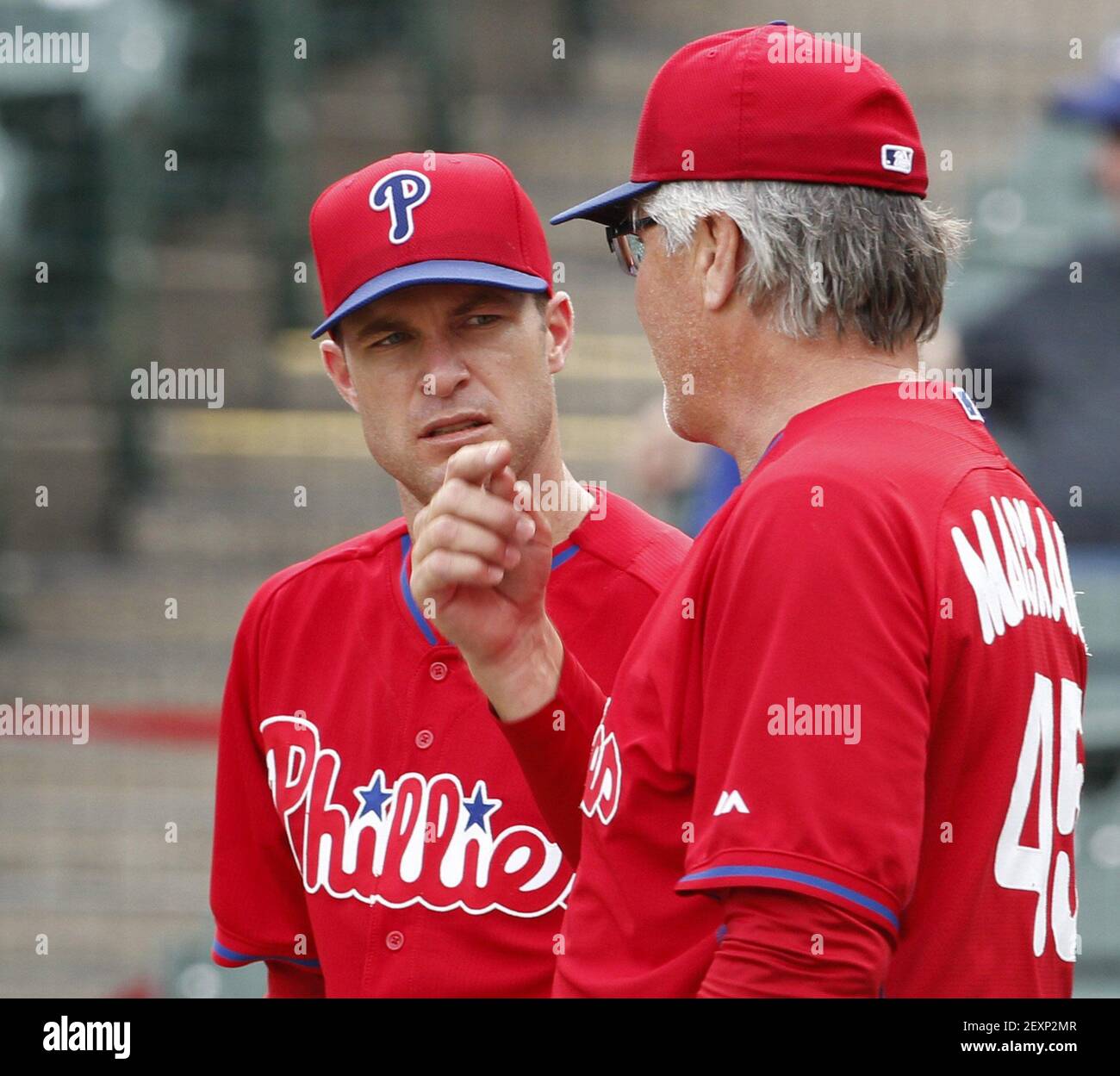 Philadelphia Phillies Jayson Nix, left, talks to coach Pete Mackanin ...