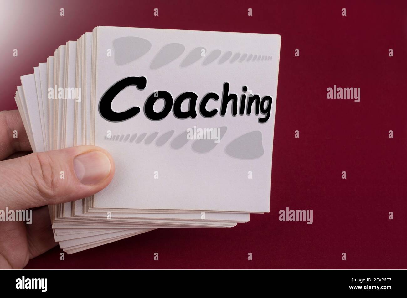 Coaching motivational sign on a red background Stock Photo - Alamy