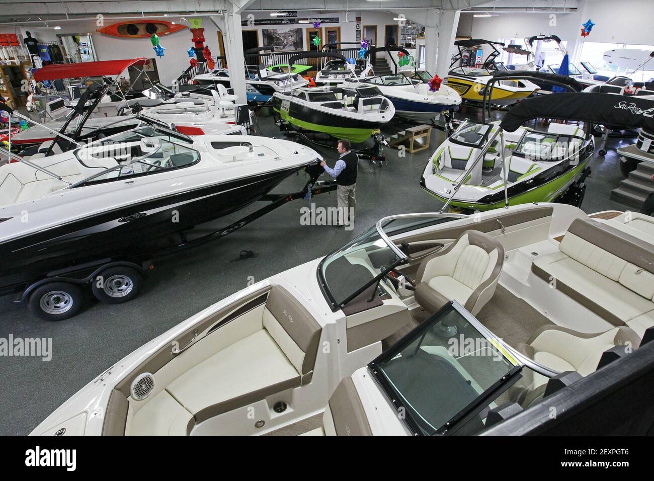 Jeremy Moore stands in the showroom of SkipperBud's boat dealership ...