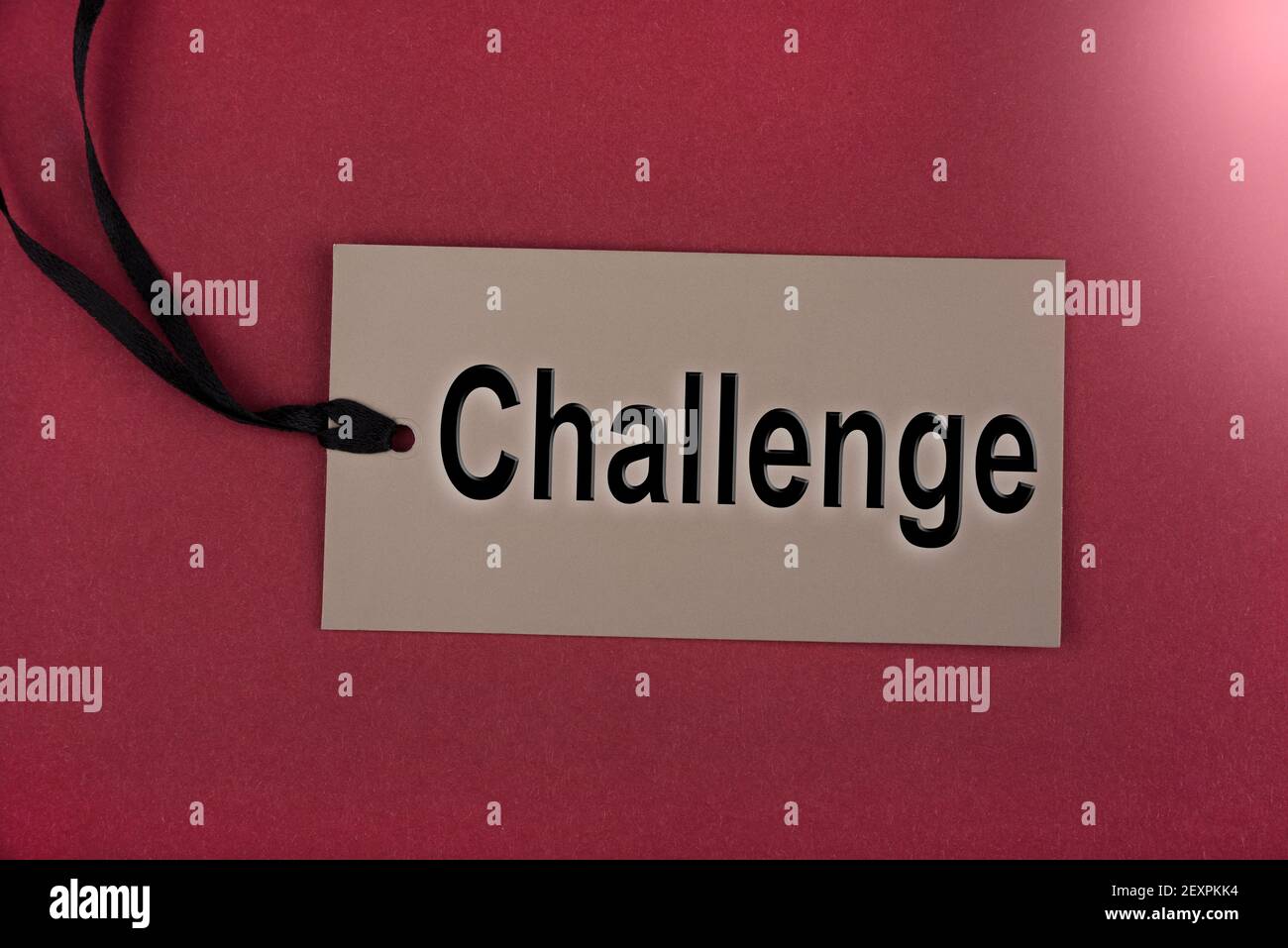 Motivational sign challenge on a red background Stock Photo - Alamy