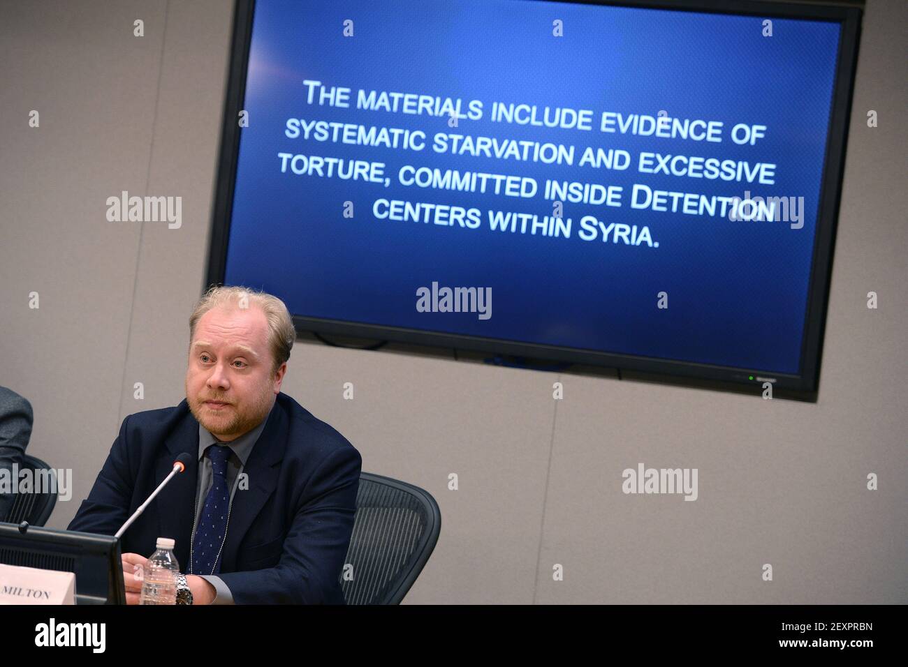 Forensic pathologist Dr. Stuart Hamilton, right, presents one of the ...