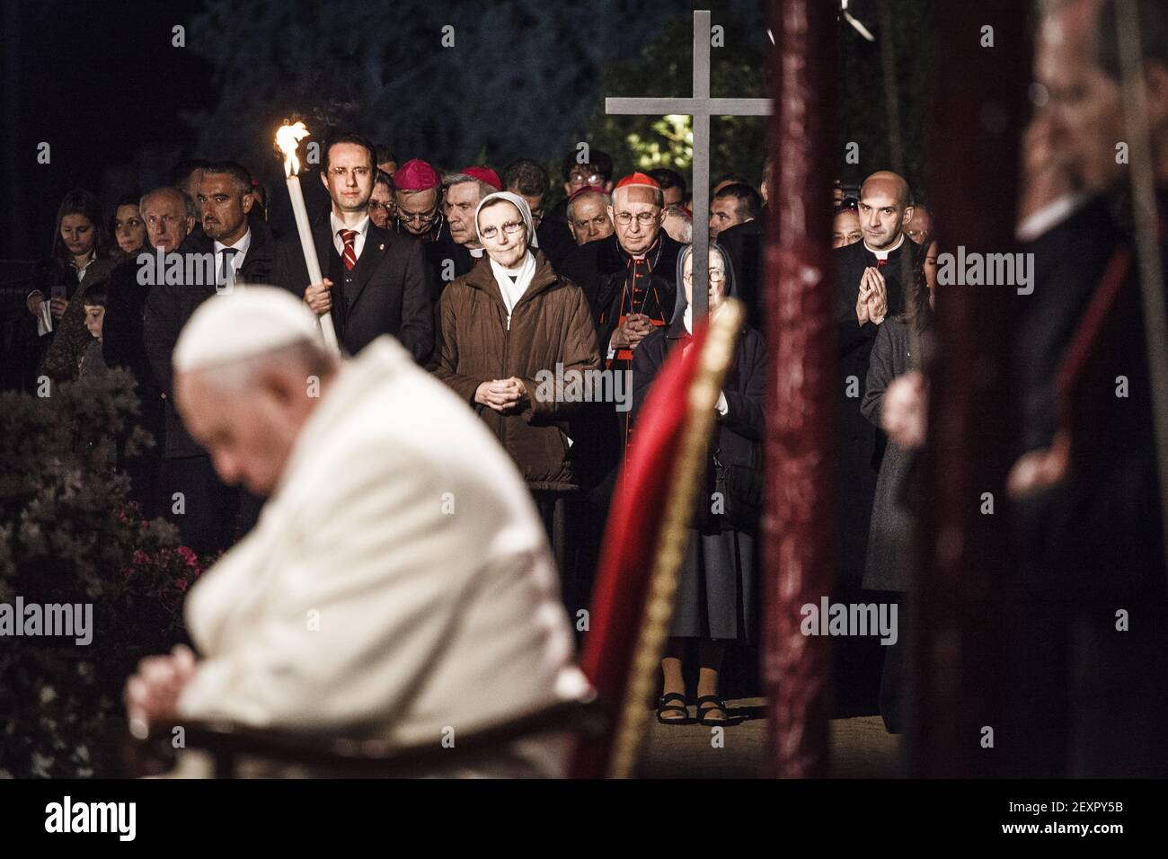 Rome, Italy â€“ April 18, 2014: Faithful hold the cross during a ...