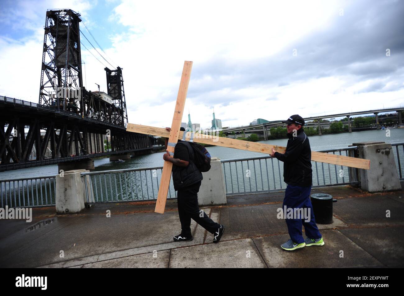 People taking part in the Jesus Experiment Cross Walk event prepare to ...