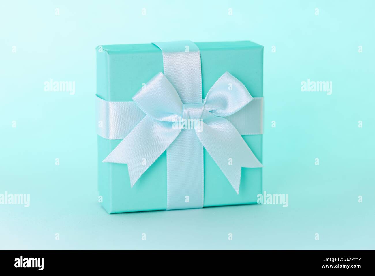 Closeup in blue gift box with beautiful ribbon Stock Photo - Alamy