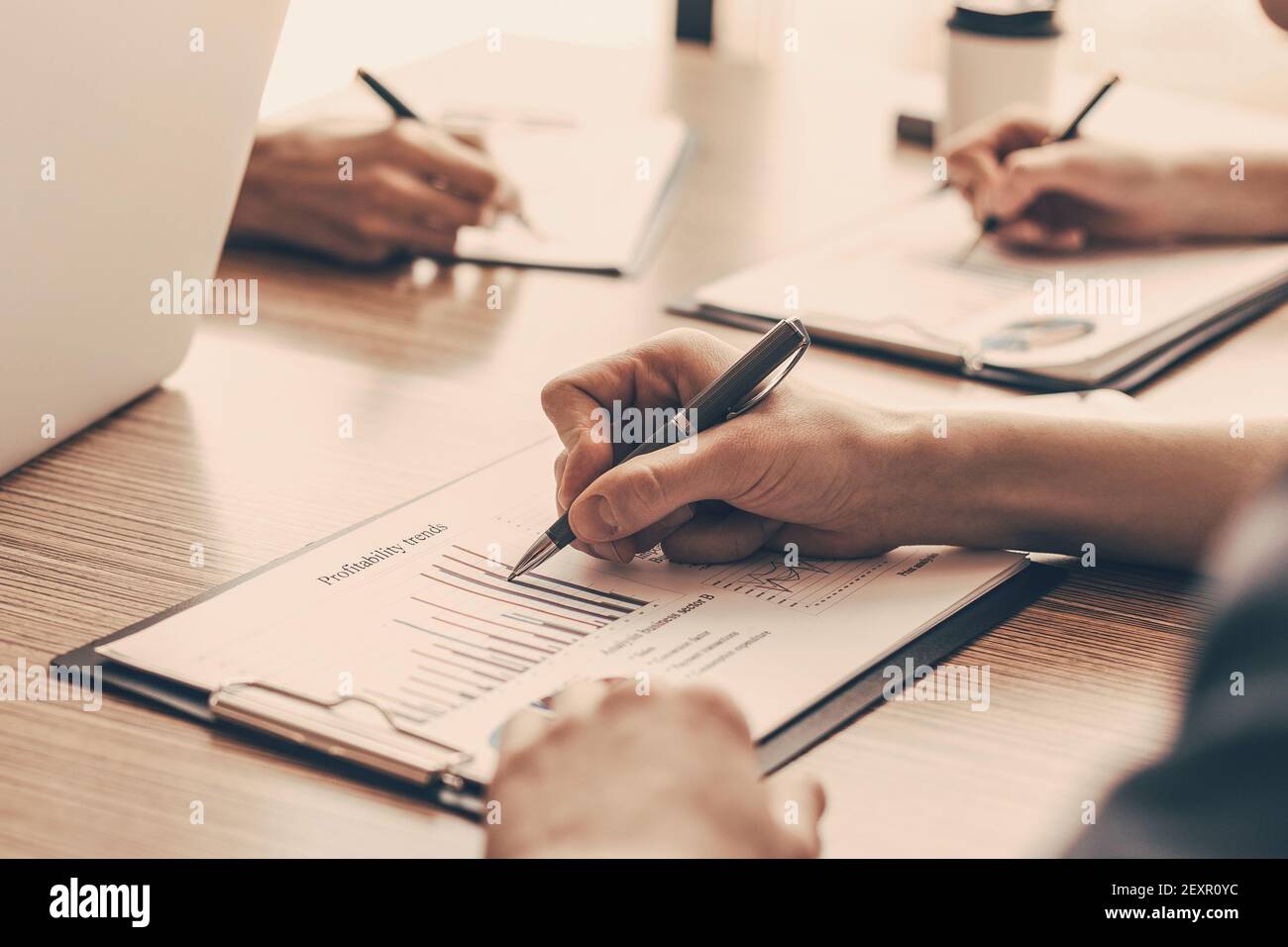 group of the employees analyzing financial charts Stock Photo - Alamy