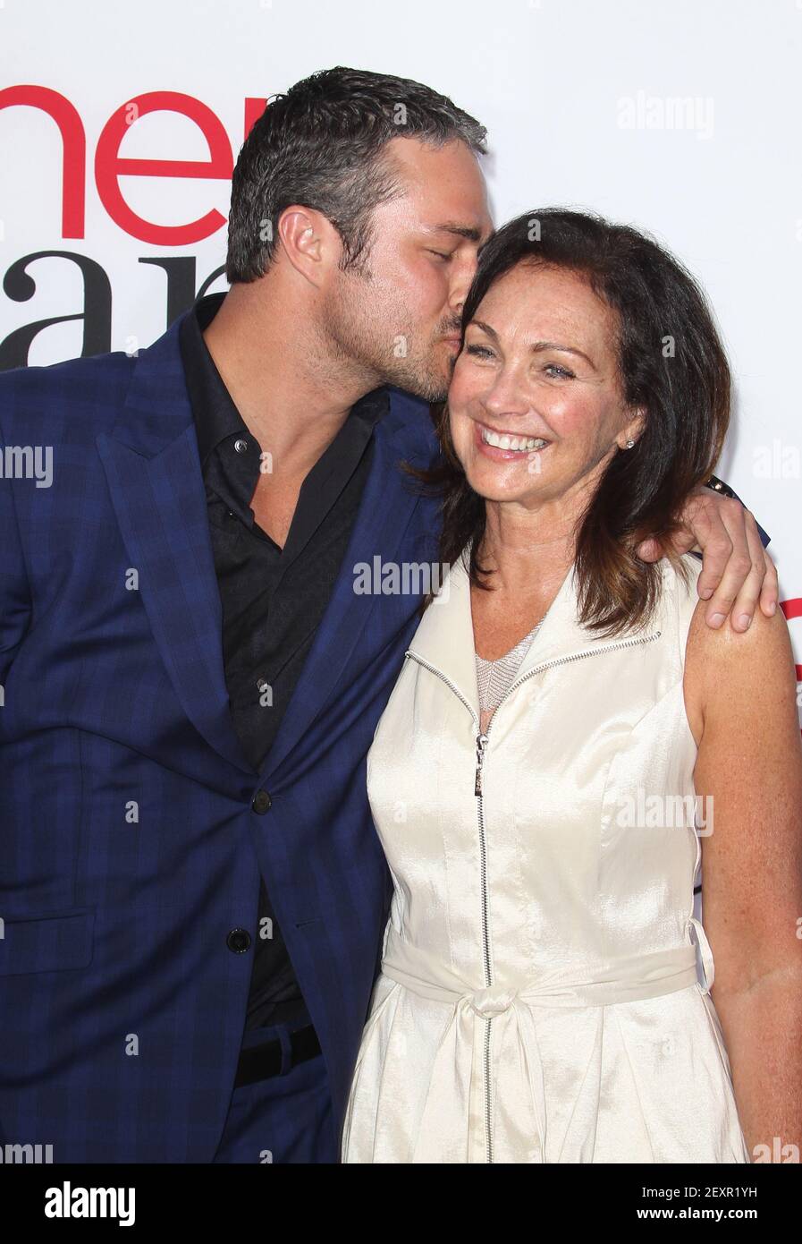 21 April 2014 - Hollywood, California - Taylor Kinney, Pamela Heisler ...