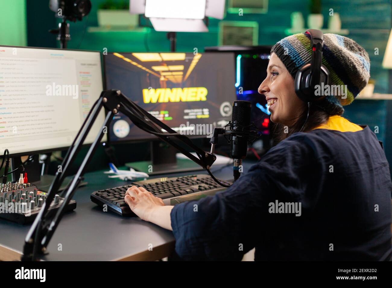 Back view of upseted streamer playing game competition using ...