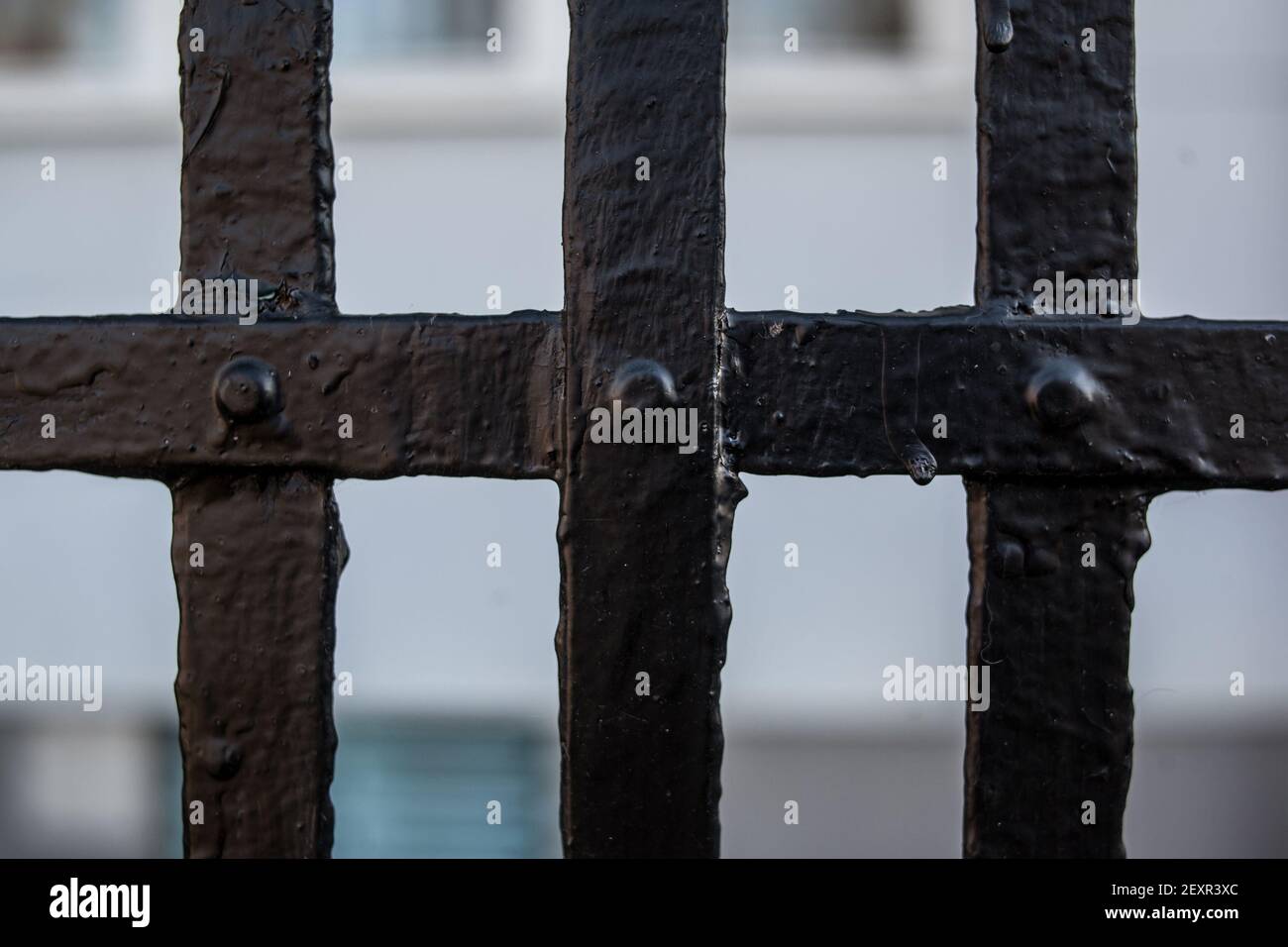 black painted metal fence. Metal rods welded together. Metal black ...