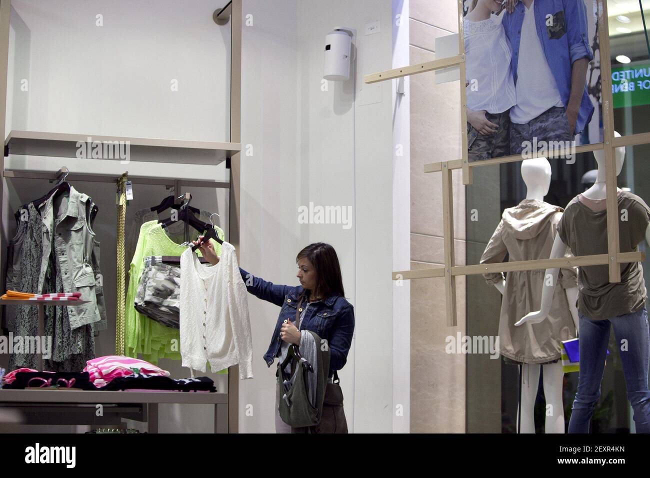 Benetton shopper Maggie Avila stands under a scent diffuser in the ...
