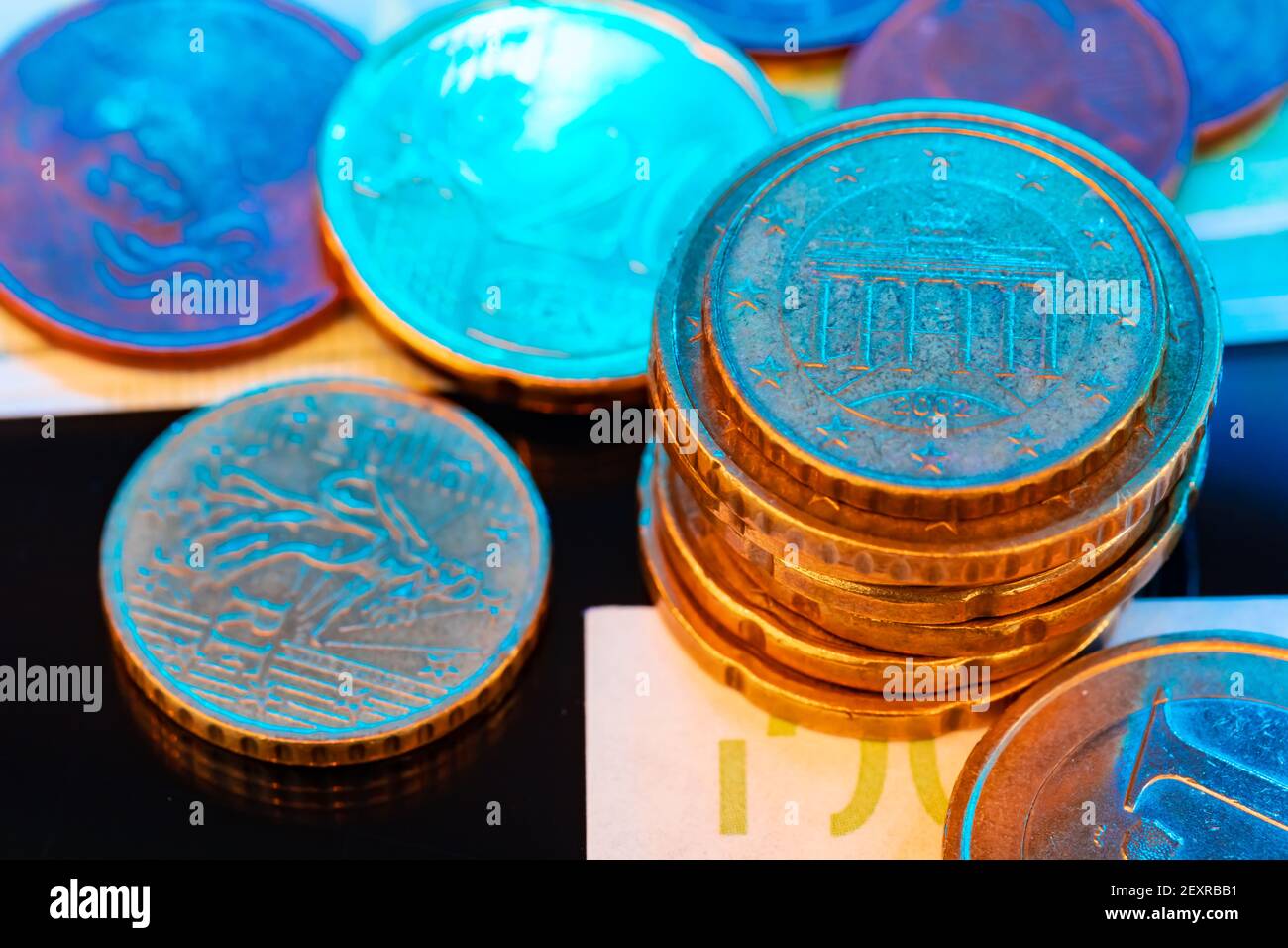 Close up of coins stacked on each other Stock Photo - Alamy