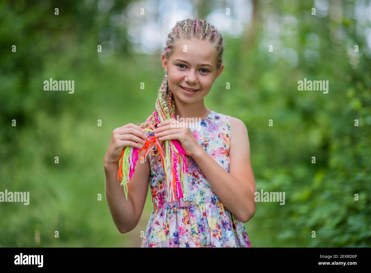 Teenage girl with multi-colored dreadlocks in the forest Stock Photo ...
