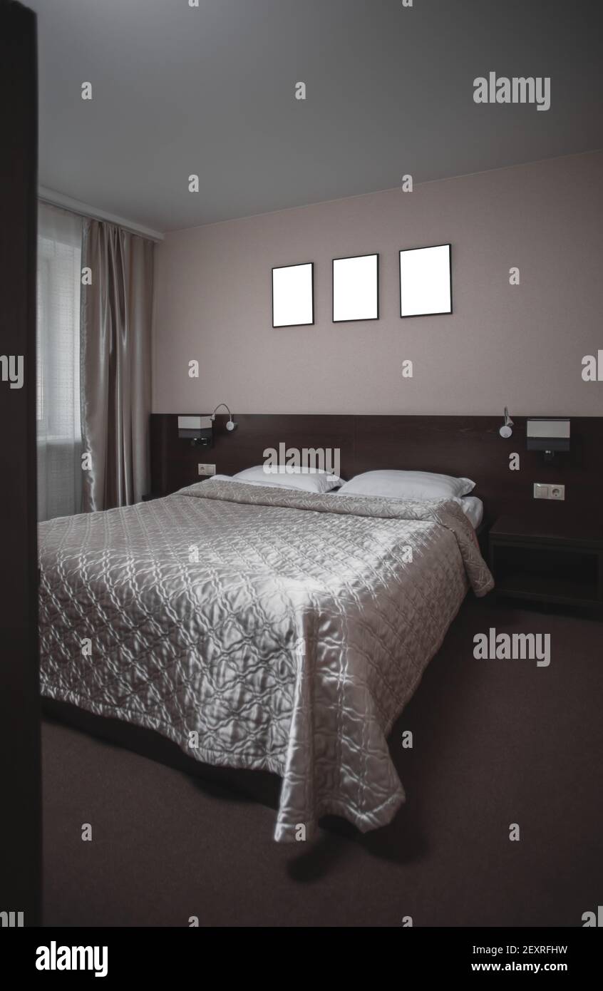 Interior of a comfortable hotel bedroom in the morning in luxury style ...