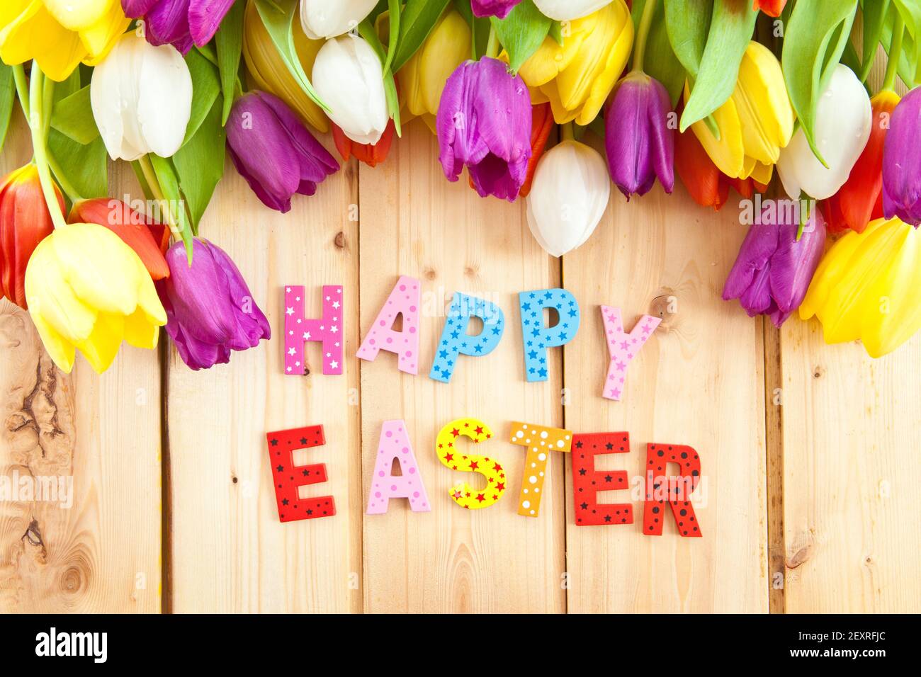 Happy Easter and colorful tulips Stock Photo - Alamy