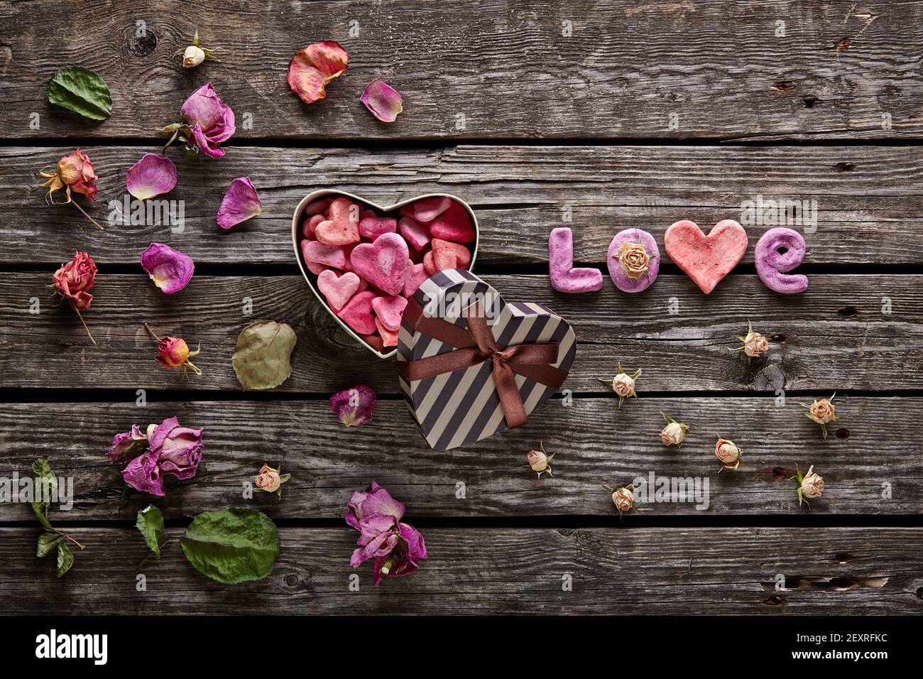 Word Love with heart shaped gift box Stock Photo - Alamy