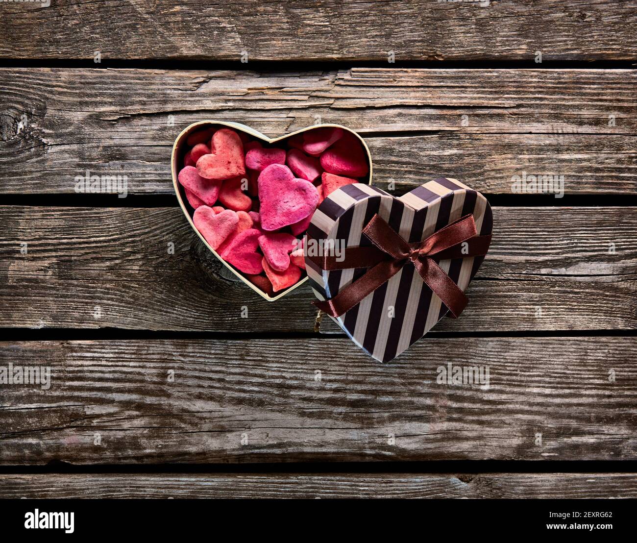 Open heart shaped gift box with heap of small hearts Stock Photo - Alamy