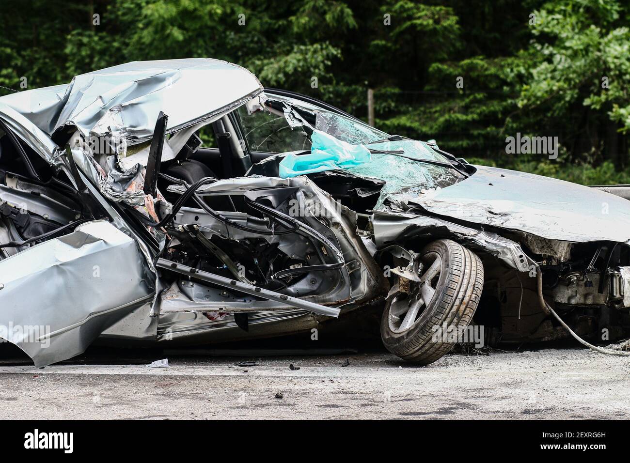 Auto accident. Crashed car in the street. Damaged car after collision ...