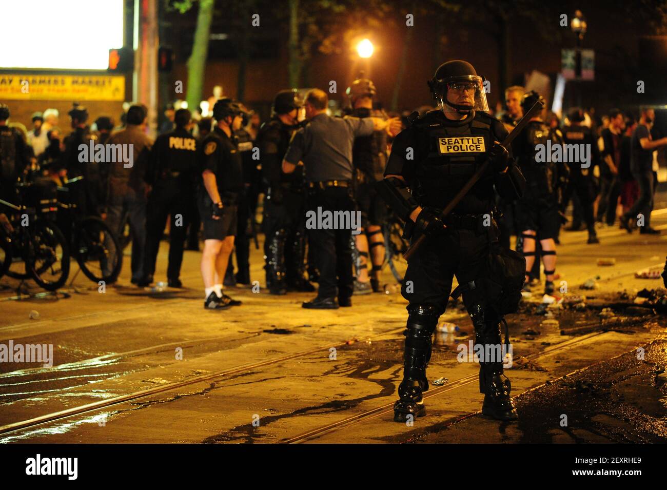 A police officer in riot gear stands guard outside of Seattle Central ...