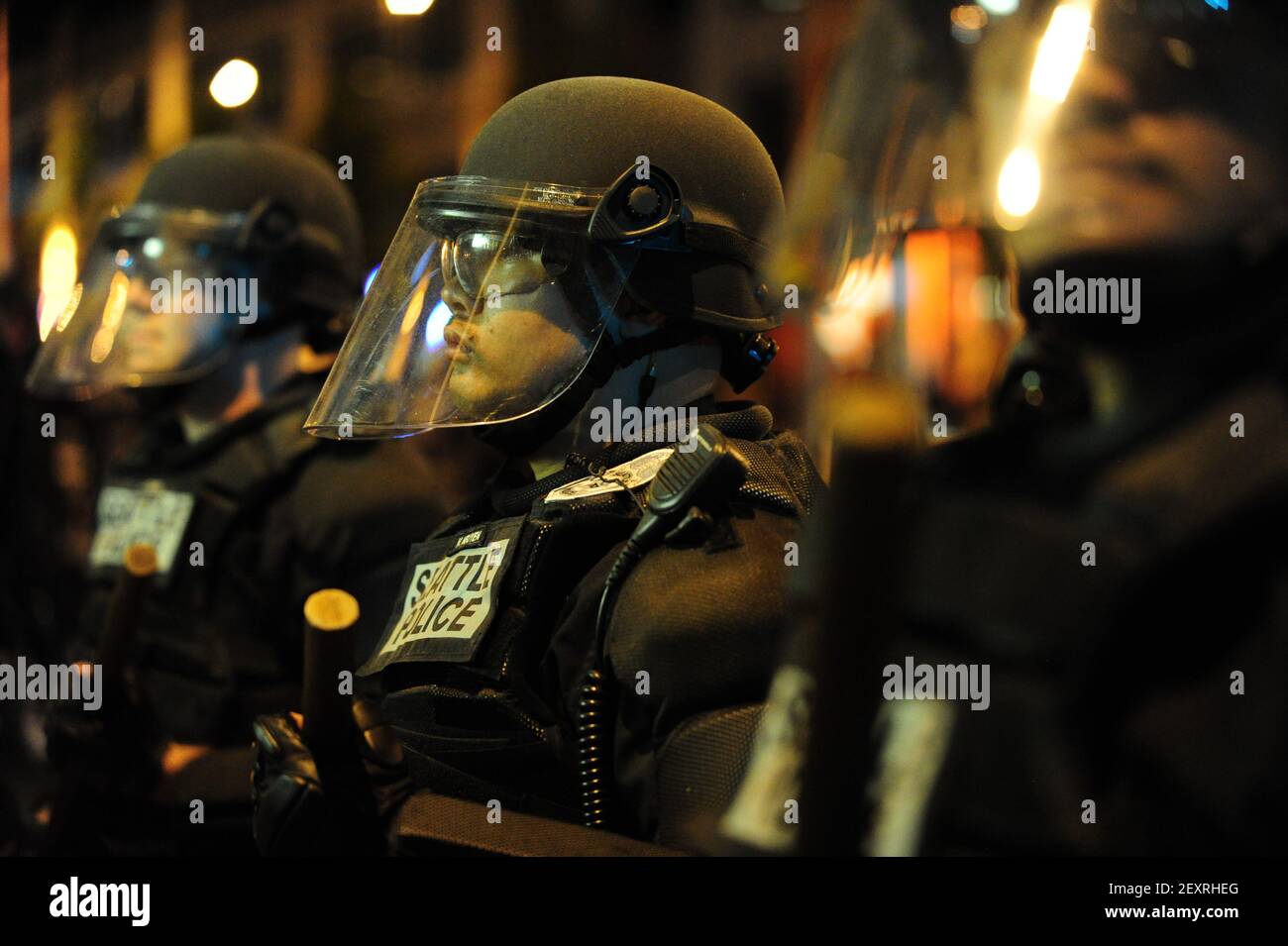 Police officers in riot gear stand guard outside of Seattle Central ...