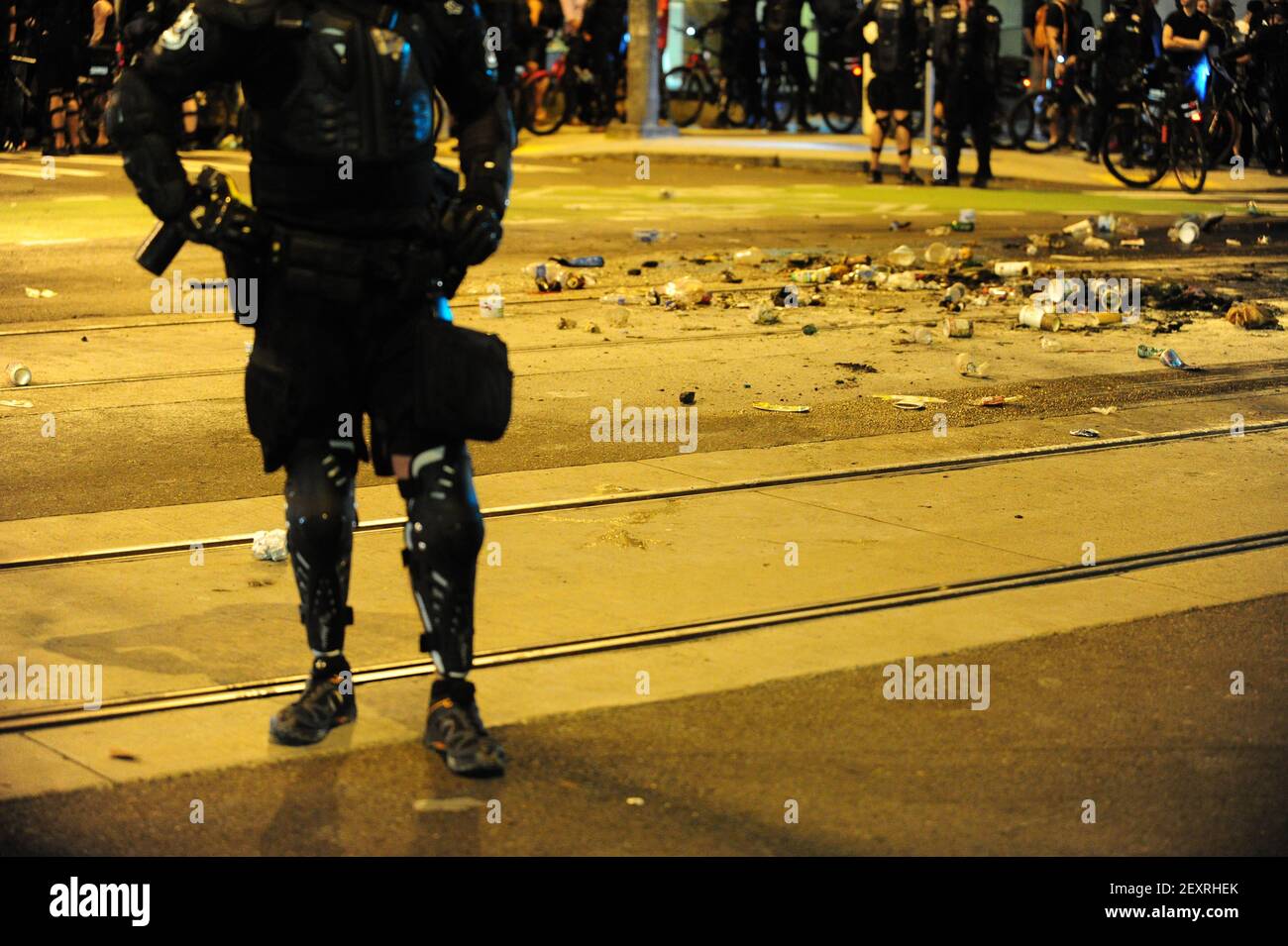 Police officers in riot gear stand guard outside of Seattle Central ...