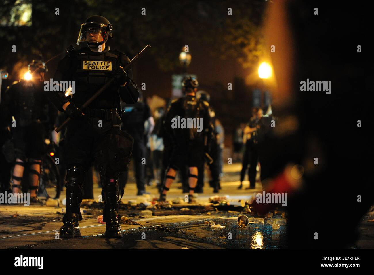 A police officer in riot gear stands guard outside of Seattle Central ...