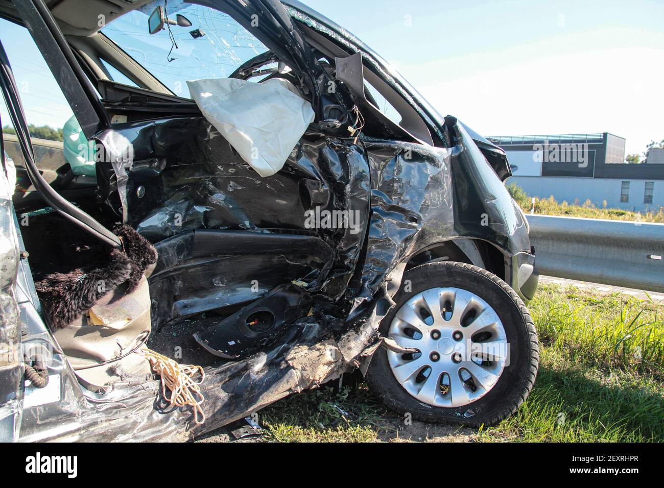 Auto accident. Crashed car in the street. Damaged car after collision ...