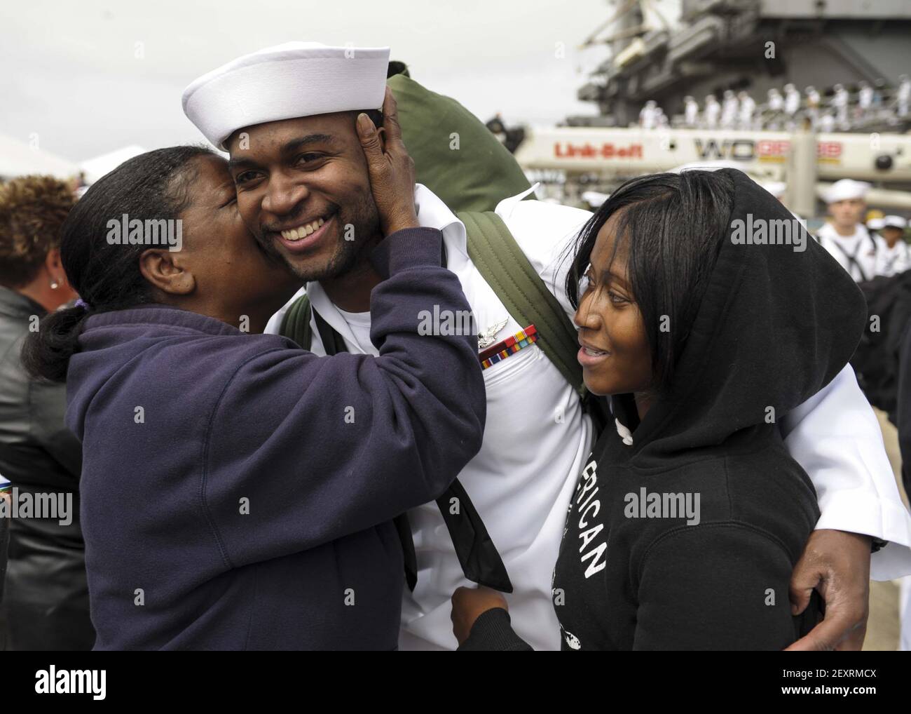 U.S. Navy Aviation Structural Mechanic 2nd Class Patrick Wiggins hugs ...