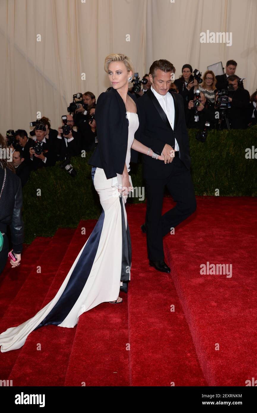 Actress Charlize Theron and boyfriend Sean Penn attend the 2014 Costume ...