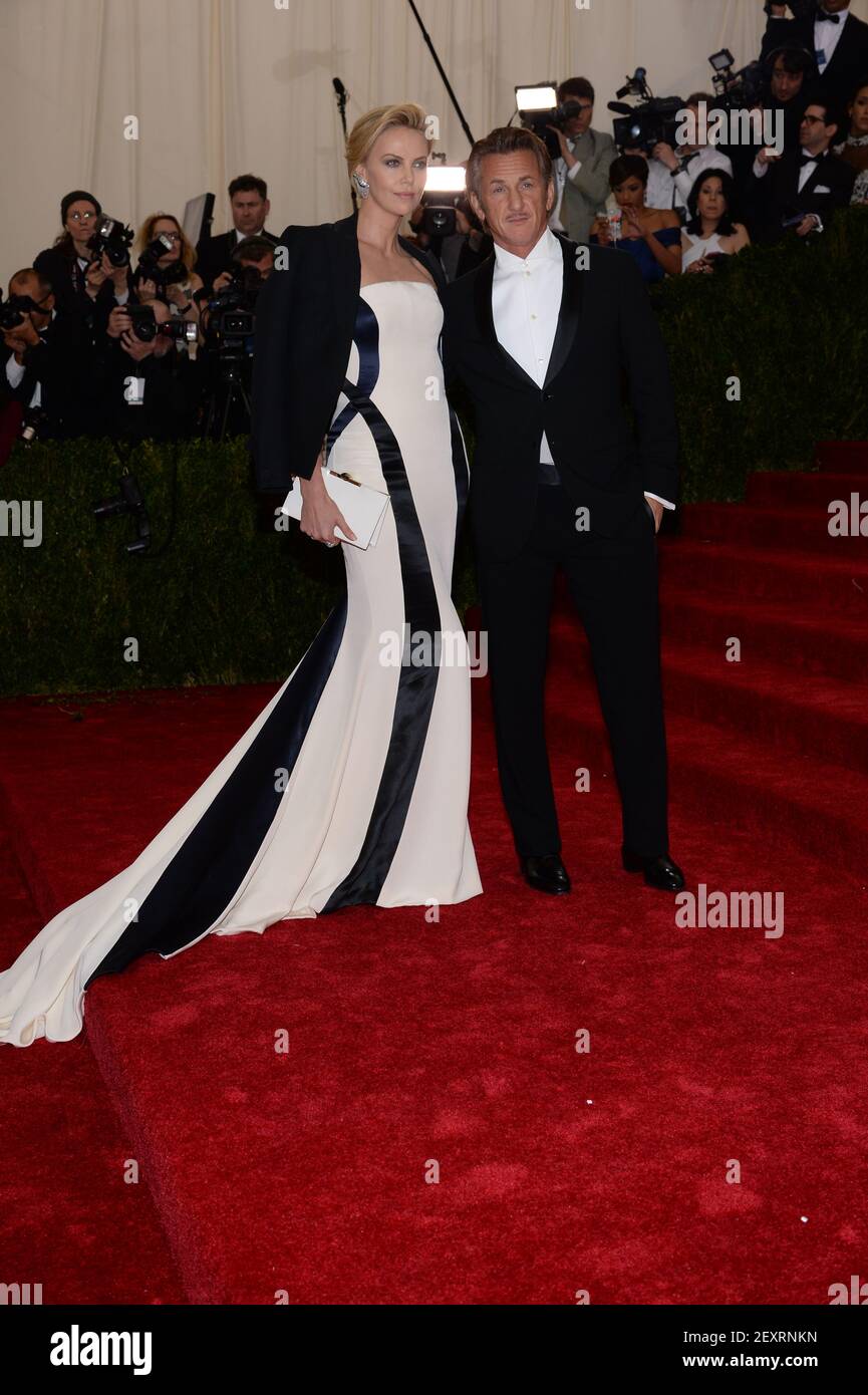 Actress Charlize Theron and boyfriend Sean Penn attend the 2014 Costume ...