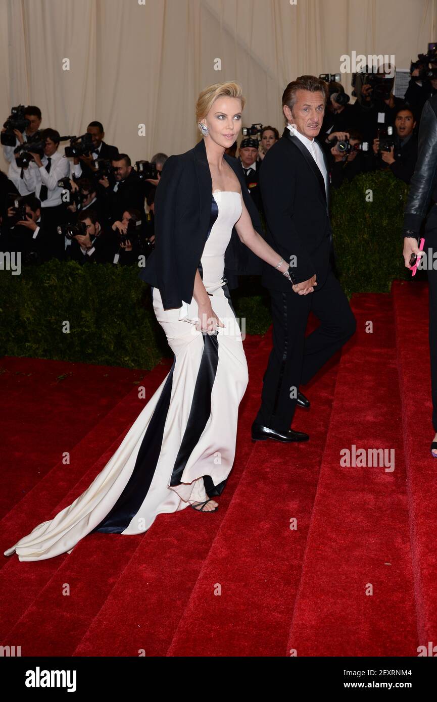 Actress Charlize Theron and boyfriend Sean Penn attend the 2014 Costume ...