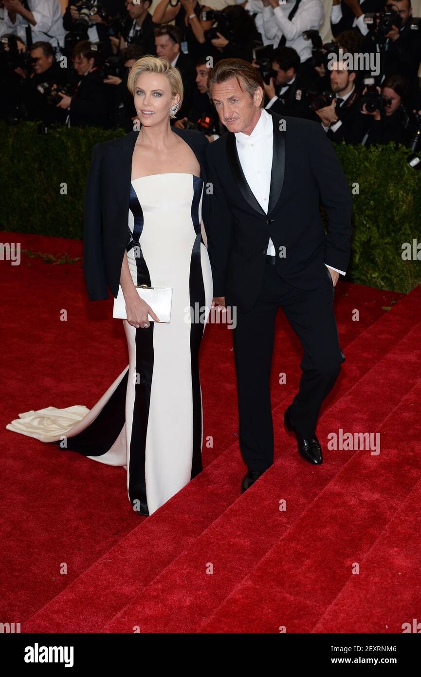 Actress Charlize Theron and boyfriend Sean Penn attend the 2014 Costume ...