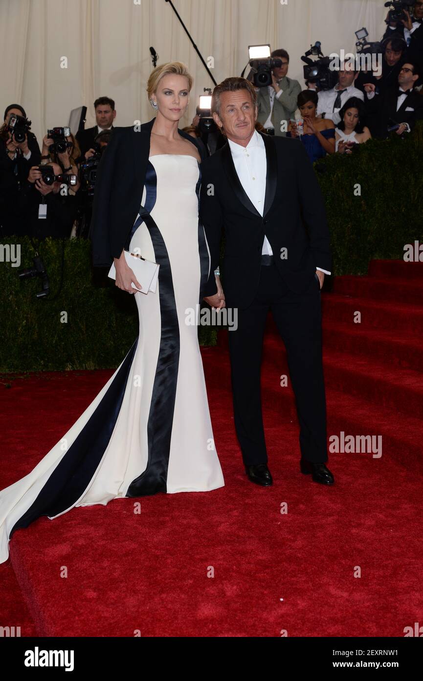 Actress Charlize Theron and boyfriend Sean Penn attend the 2014 Costume ...