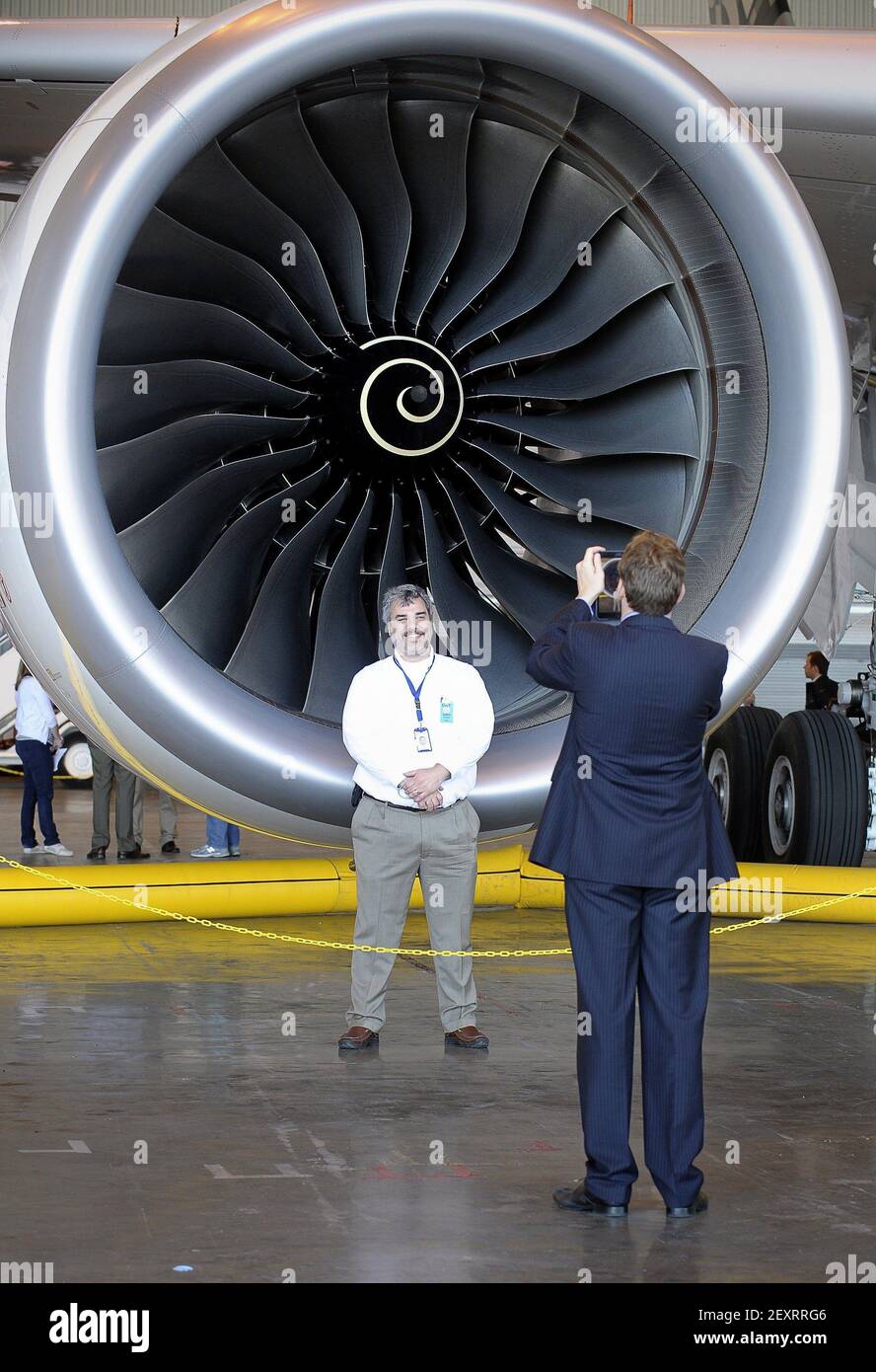 Employees take photos around the Airbus A350 as groups of American ...