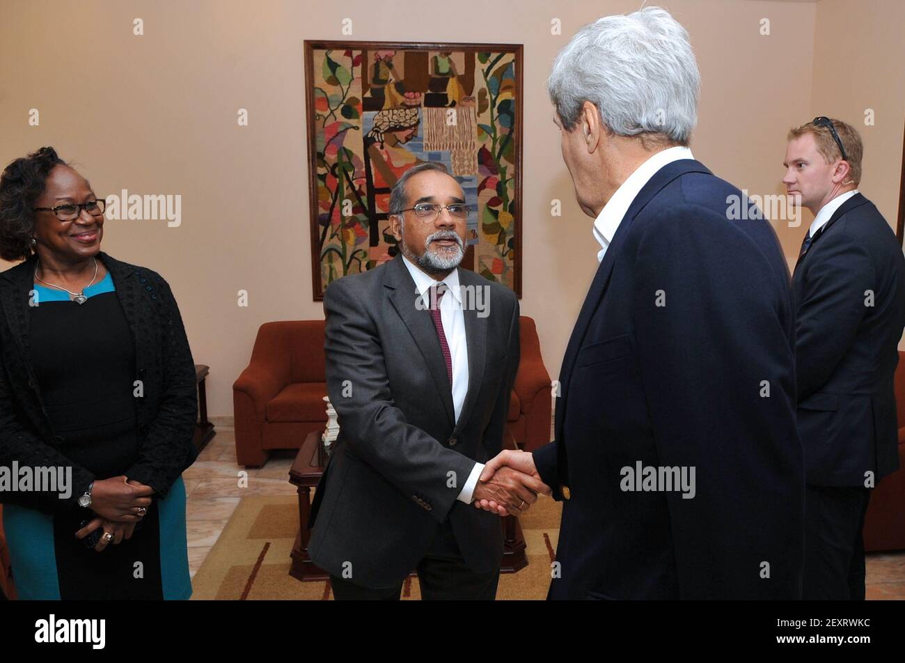 U.S. Secretary of State John Kerry shakes hands with Foreign Minister ...