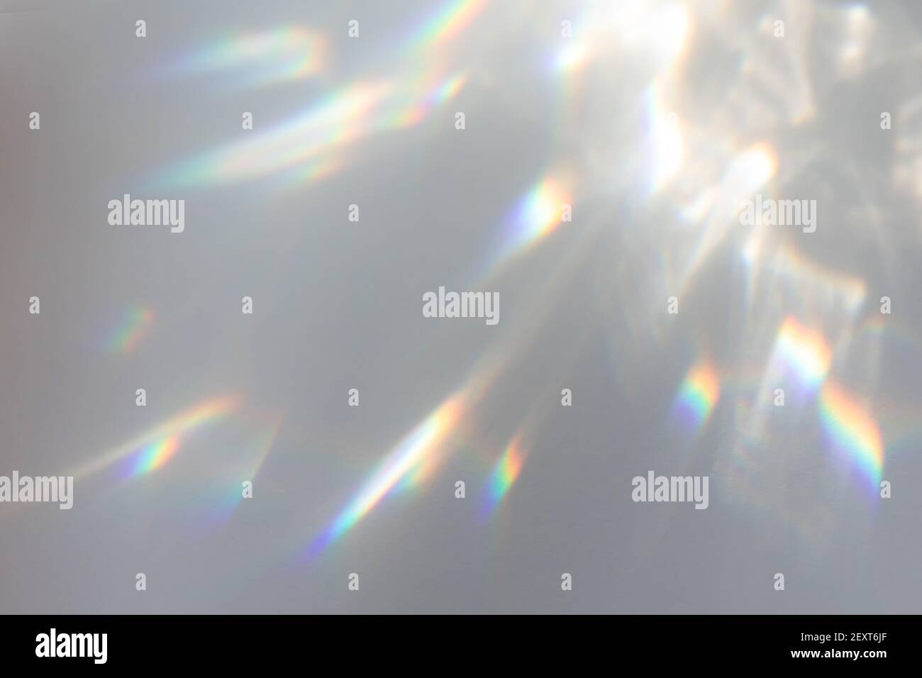 Blurred rainbow light refraction texture on white wall Stock Photo - Alamy