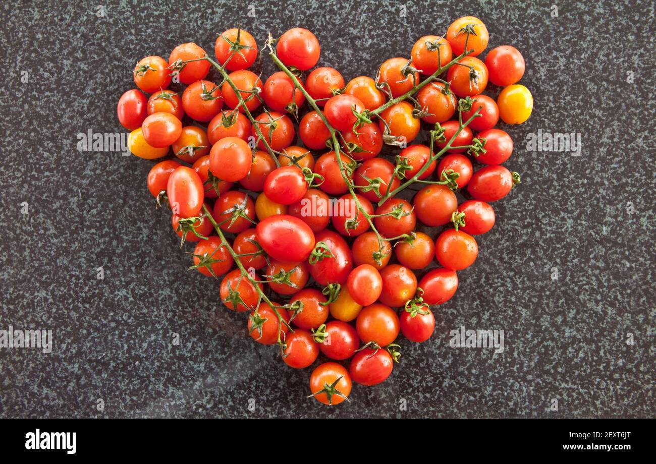 Colorful tomatoes in the shape of a heart Stock Photo - Alamy