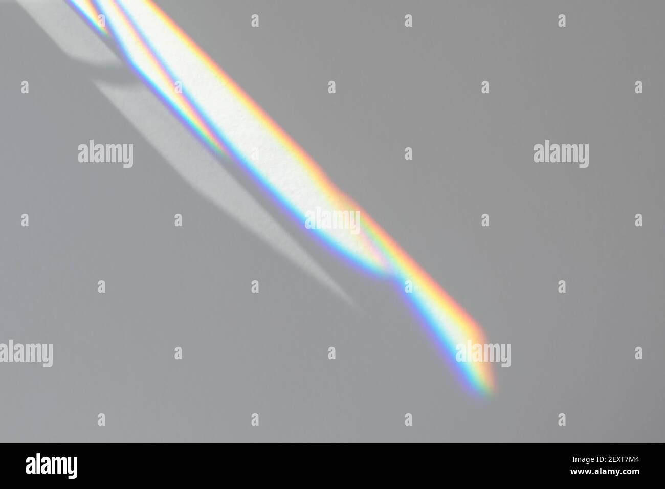 Blurred rainbow light refraction texture on white wall Stock Photo - Alamy