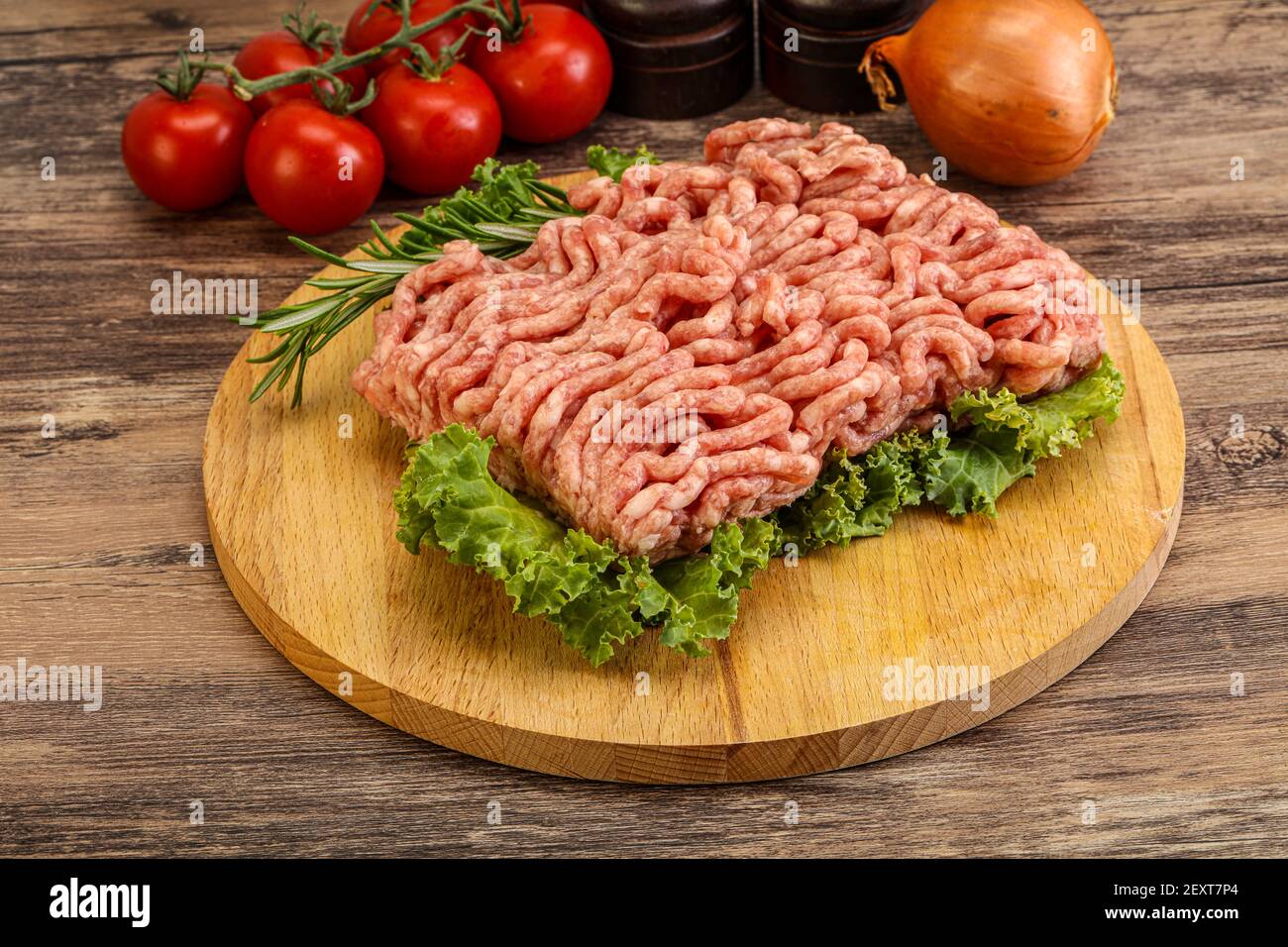 Raw pork minced meat over board for cooking Stock Photo - Alamy