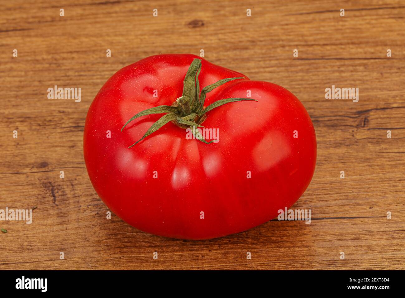 Ripe tasty red big tomato over background Stock Photo - Alamy