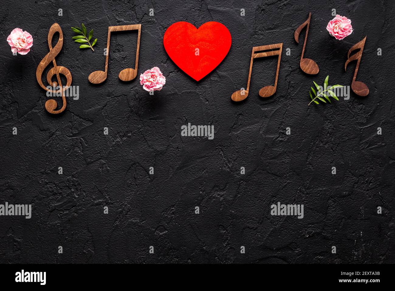 Love songs. Valentines day music with notes and flowers Stock Photo - Alamy