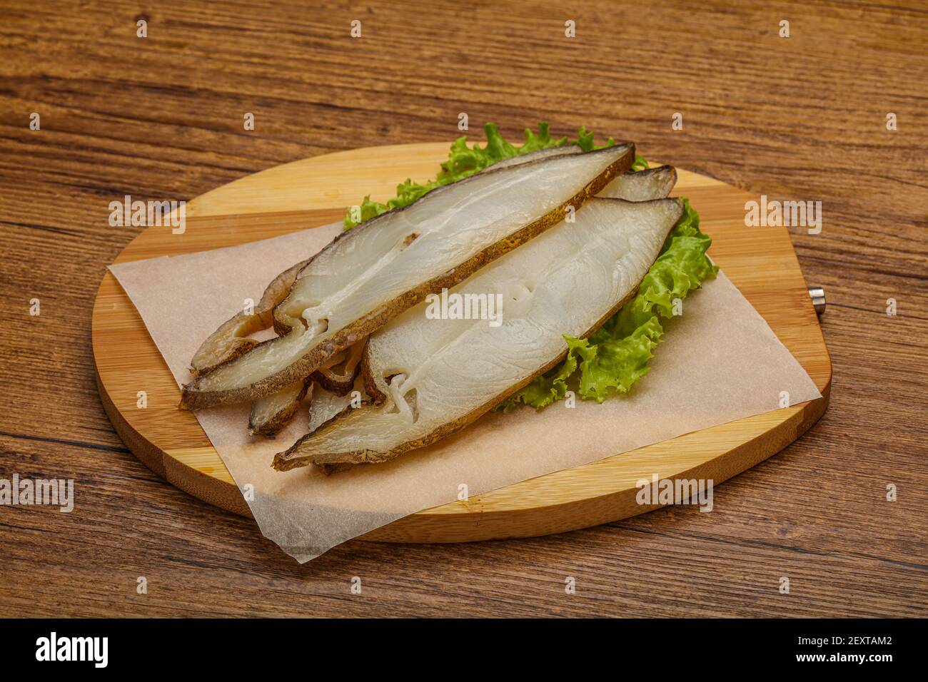 Delicous smoked halibut fish slices snack Stock Photo - Alamy