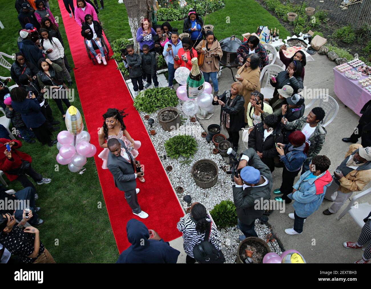 Family, friends and neighbors applaud as TeÃªairah Gaylord and Raymond ...