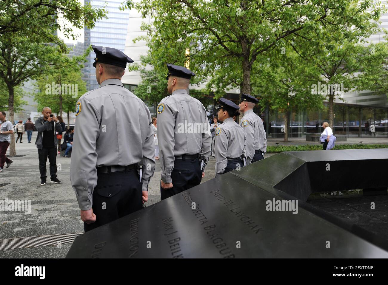 Port Authority Police Academy cadets stand by the South reflecting pool ...