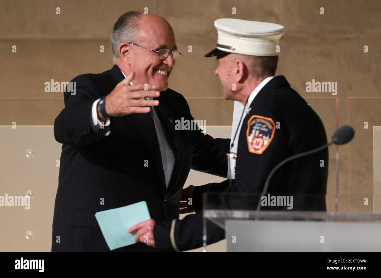 Former New York Mayor Rudolph Giuliani hugs FDNY Lt Mickey Kross during ...