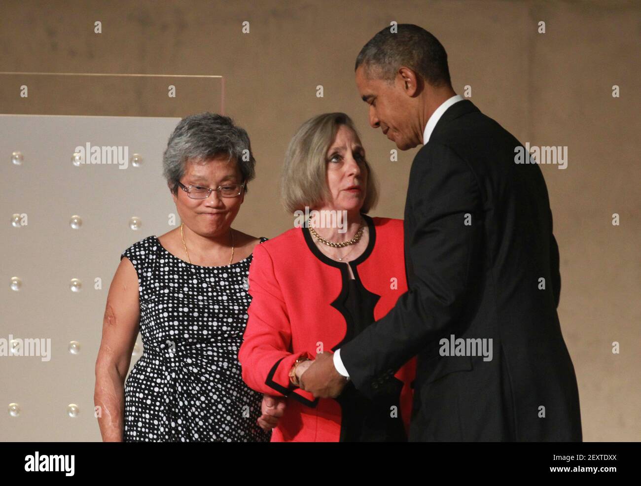 President Barack Obama greets Ling Young and Alison Crowther during the ...