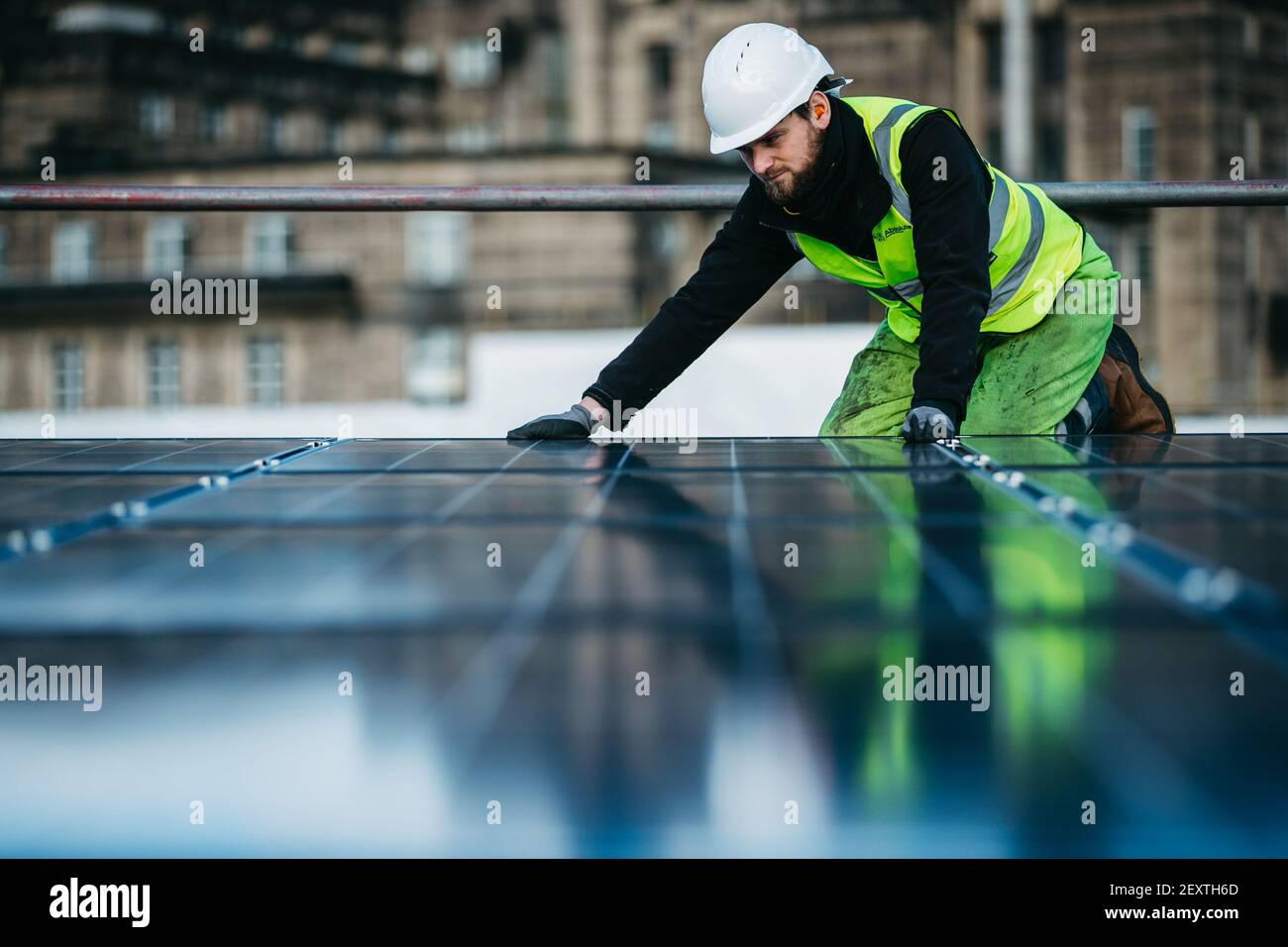Fitting solar panels to roof hi-res stock photography and images - Alamy