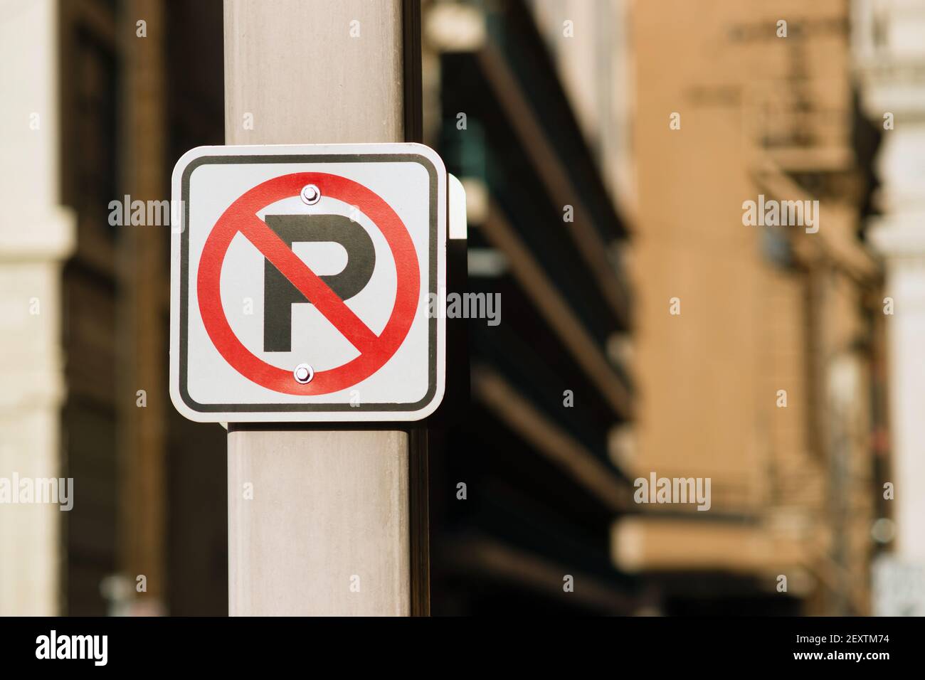 No Auto Parking Sign Bolted to Light Post Downtown Stock Photo - Alamy