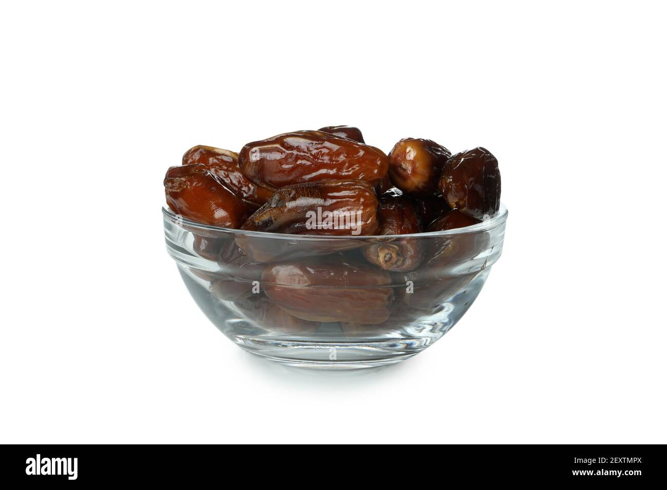 Glass bowl of dates isolated on white background Stock Photo - Alamy