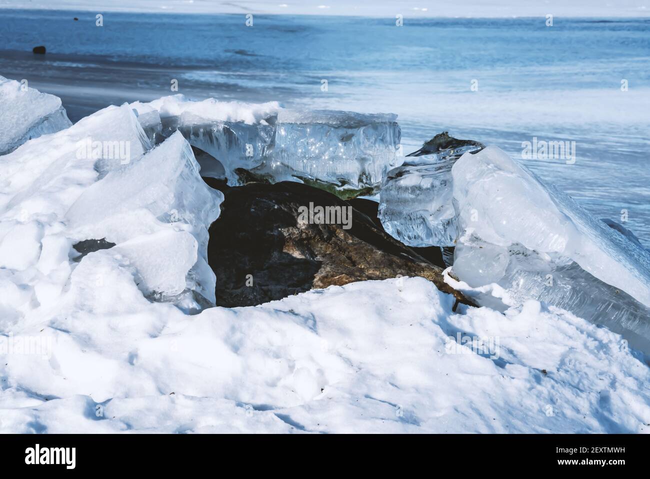 Glacial ice melting away revealing rocks and boulders beneath Stock ...
