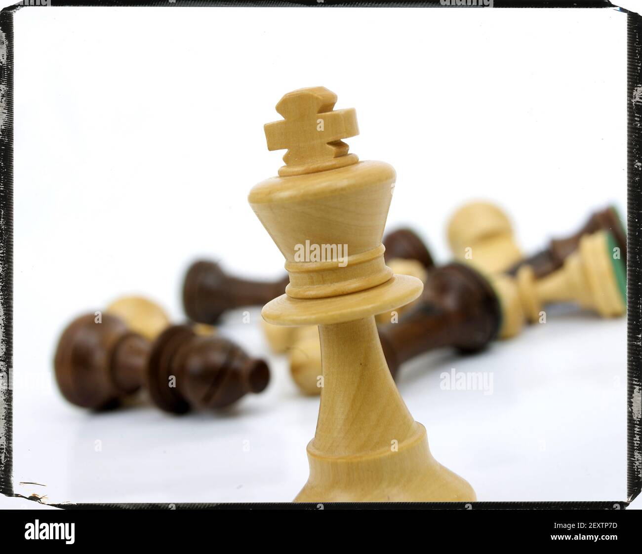A selective shot of a falling chess piece king isolated on the blurred ...