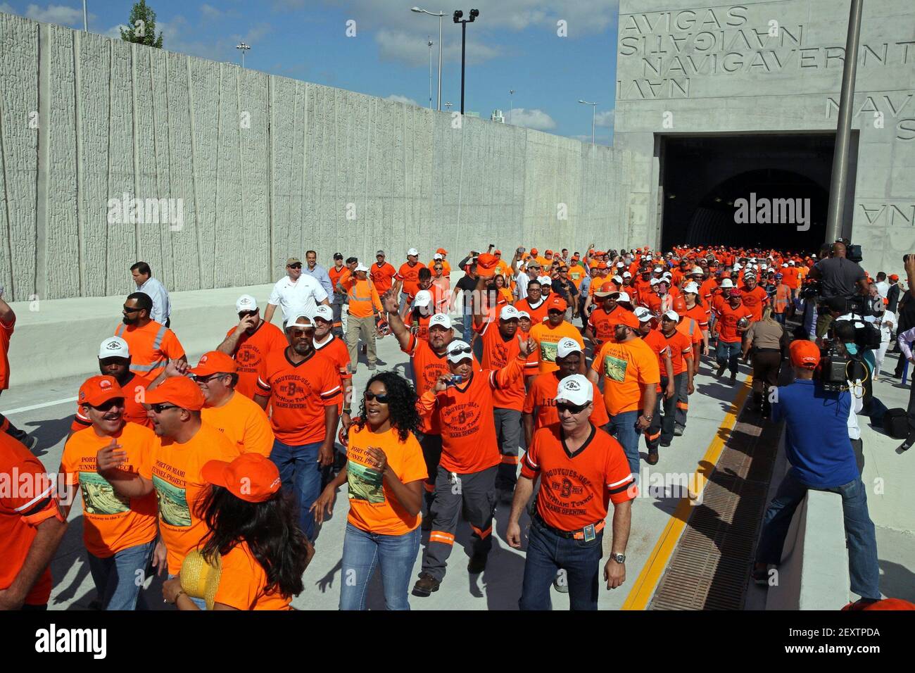 Hundreds of construction workers march through the Miami Tunnel during ...